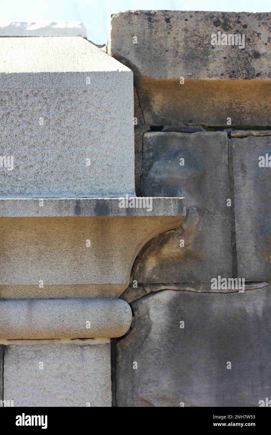 Worn and weathered wall made out of natural limestone masonry blocks ...