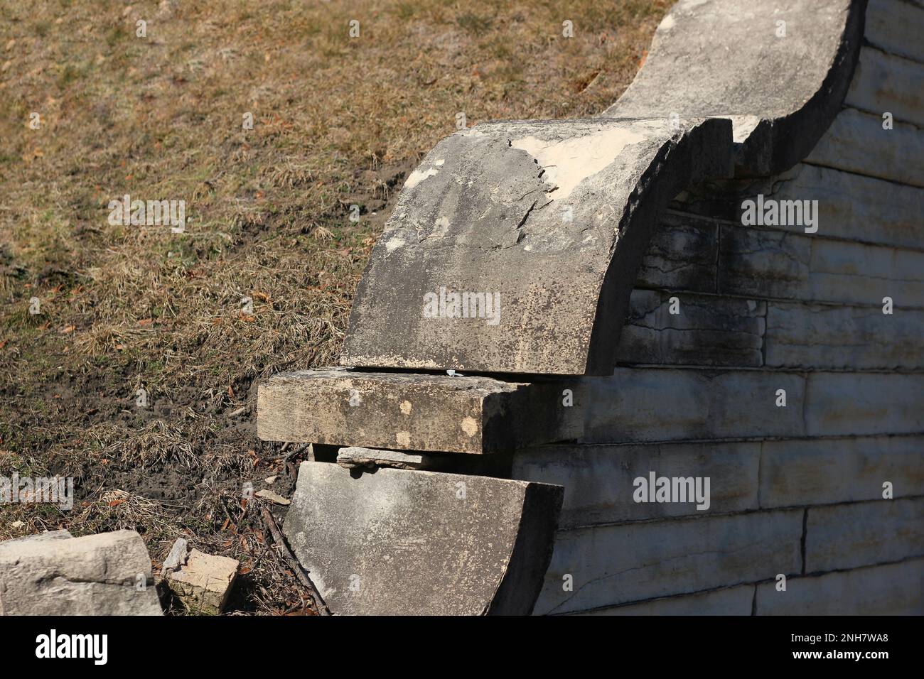 Worn and weathered wall made out of natural limestone masonry blocks ...