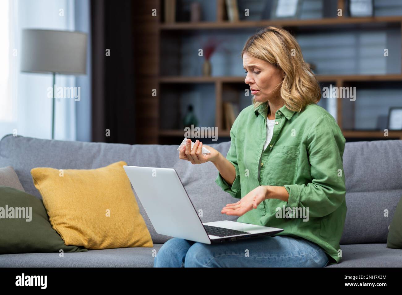 Mature lonely woman alone at home, crying in depression talking on ...
