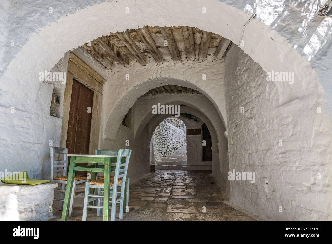 Characteristic arched alleyway in the mountain village of Apeiranthos ...