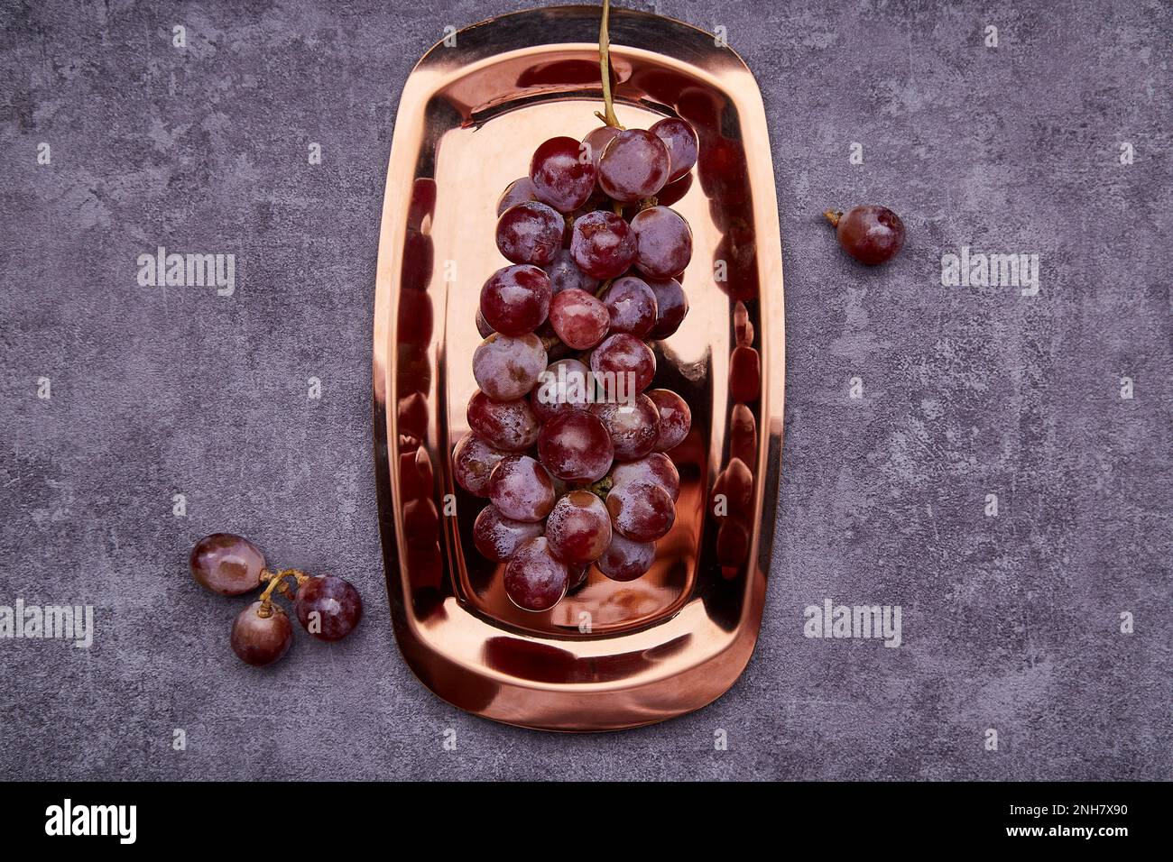 Aesthetic grapes on the golden tray Stock Photo - Alamy