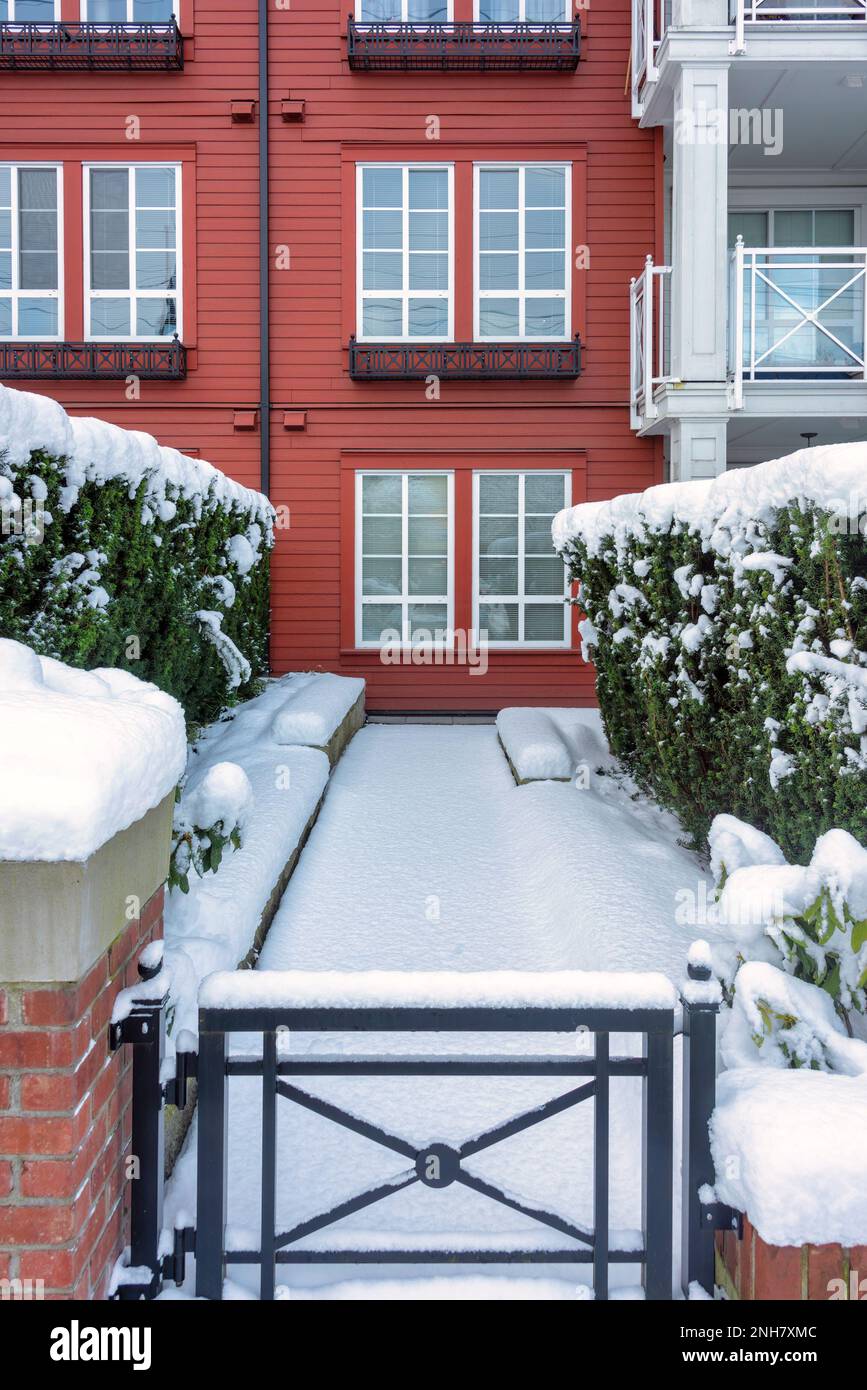 Pathway to residential building covered with snow Stock Photo - Alamy