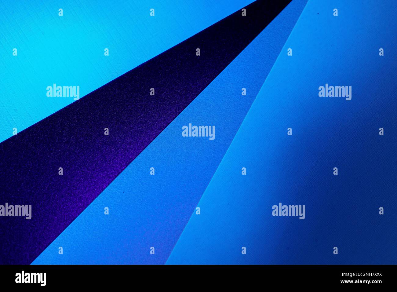 Blank carton paper sheets background in dark blue light Stock Photo - Alamy