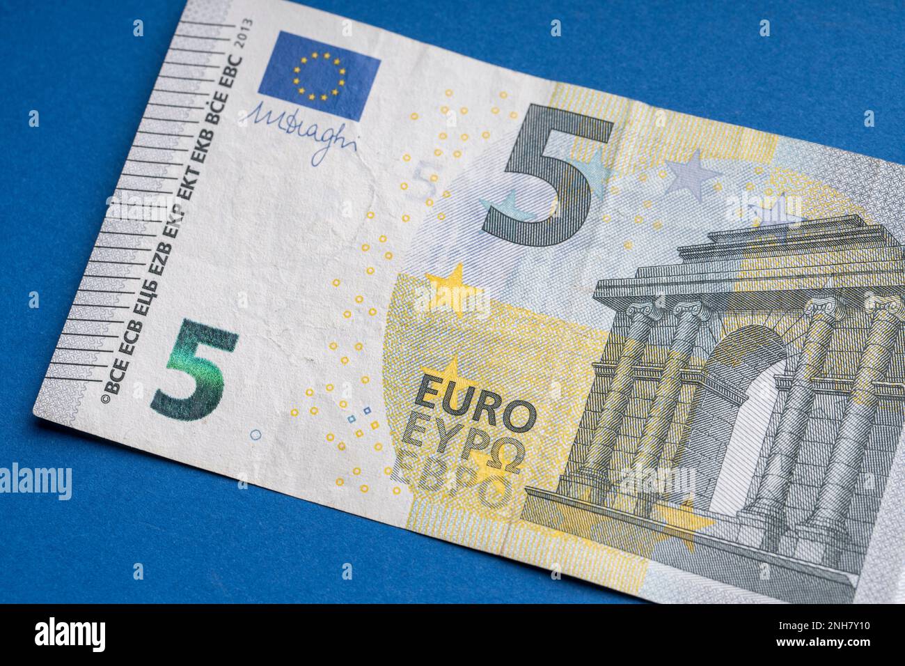 5 euro banknote close up, blue background for business finance topics ...