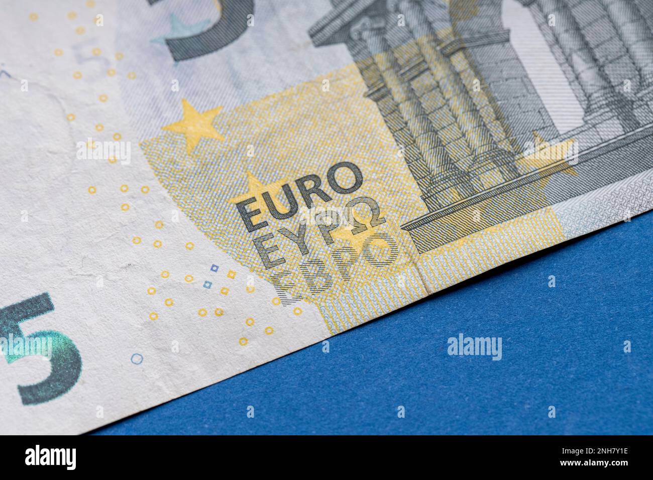5 euro banknote close up, blue background for business finance topics ...