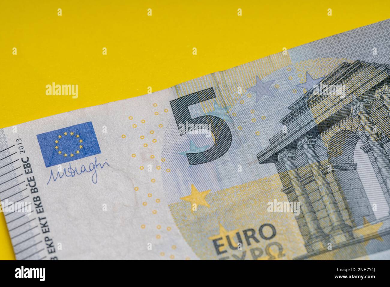 5 euro banknote close up, yellow background for business finance topics ...