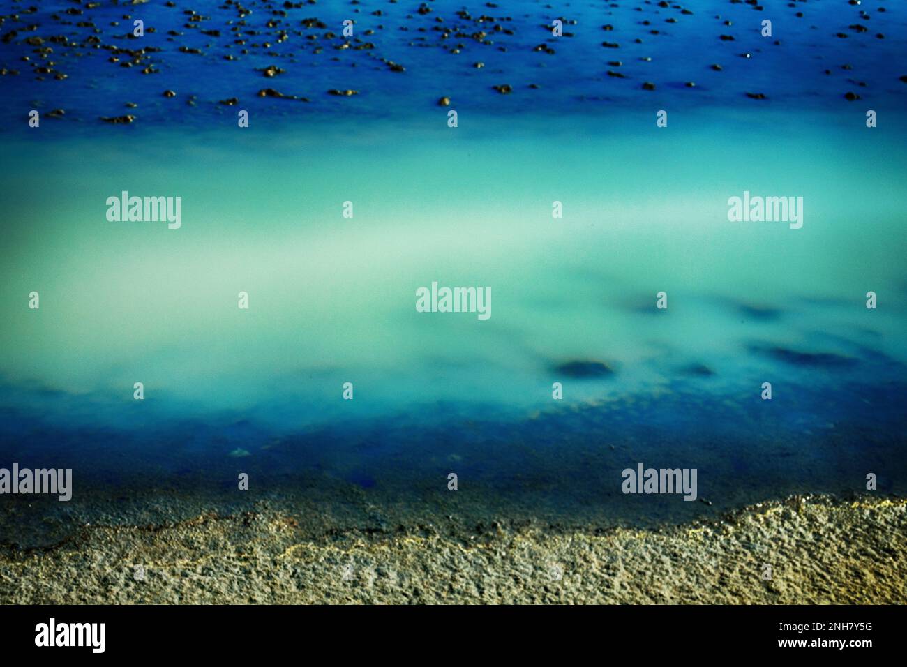 Hydrogen sulfide stagnant salt marsh. Gas turns turbid-blue in water on ...