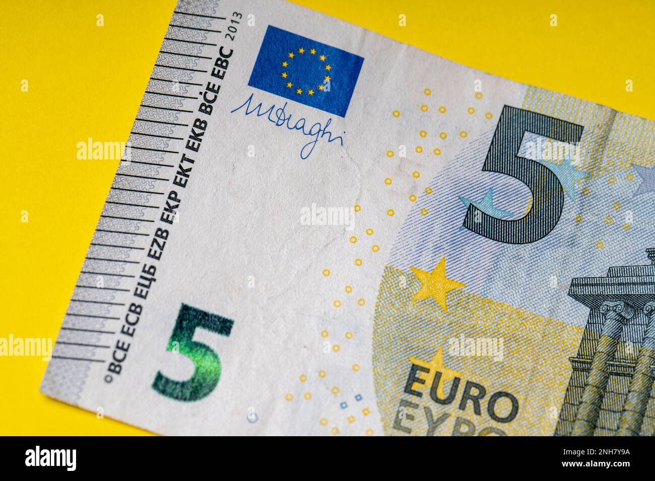 5 euro banknote close up, yellow background for business finance topics ...