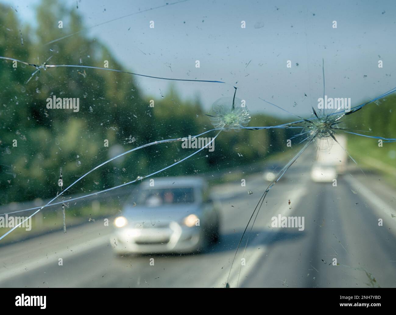 Highway through a broken windshield after encountering a truck with ...