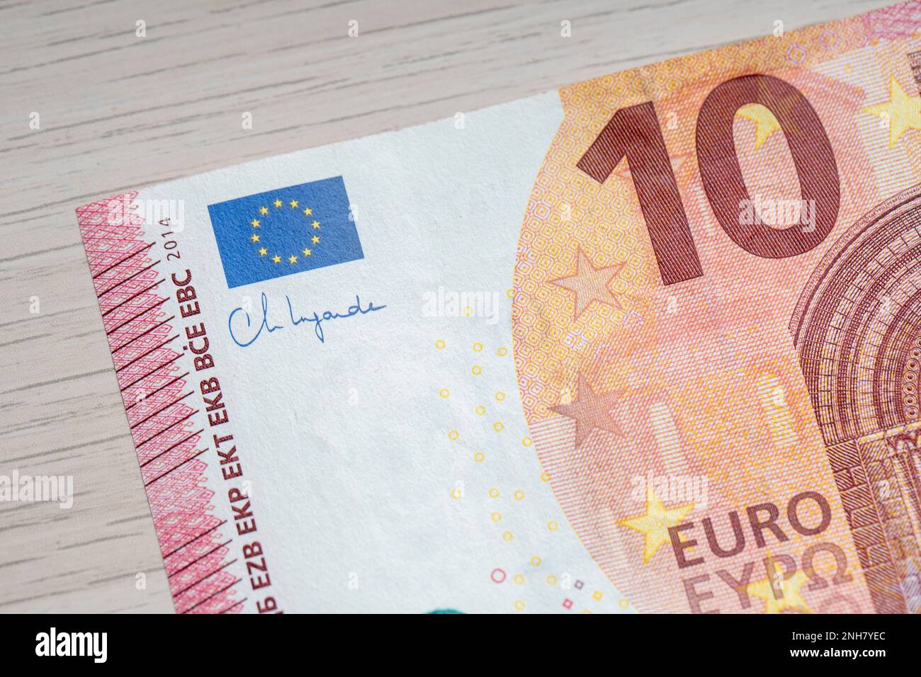 10 euro banknote close up, wooden table background for business finance ...