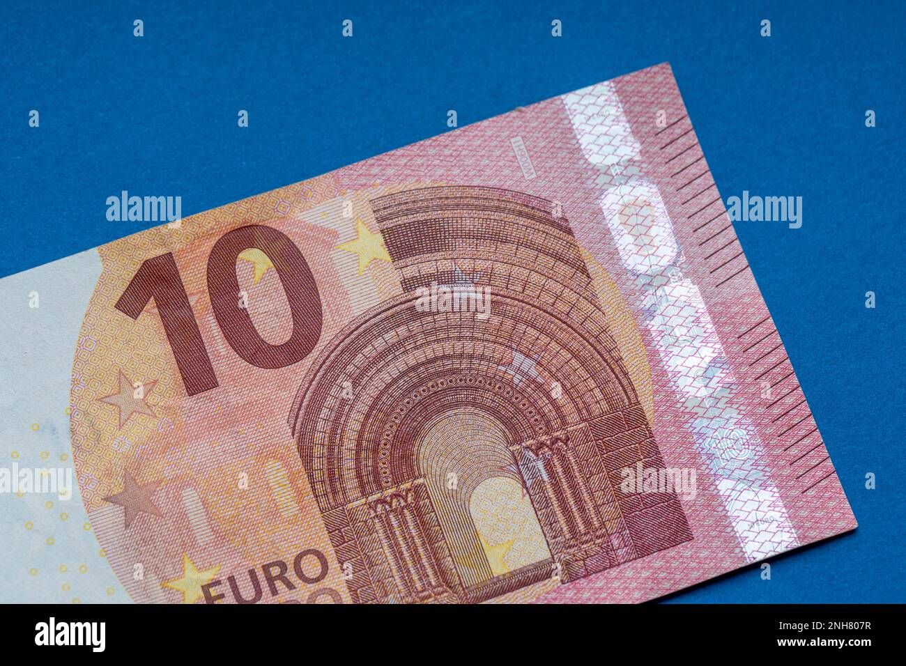 10 euro banknote close up, blue background for business finance topics ...