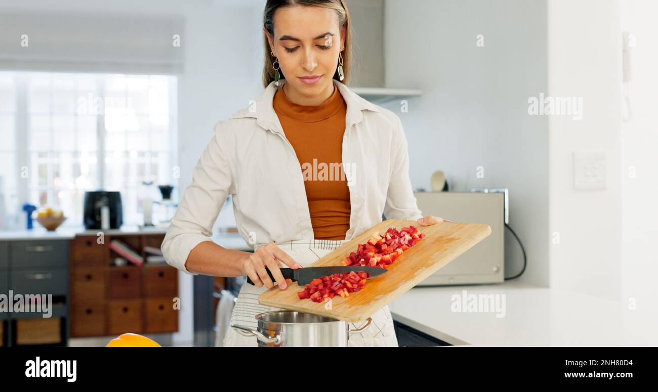 Woman, cooking and kitchen, vegetable and nutrition, board and knife ...