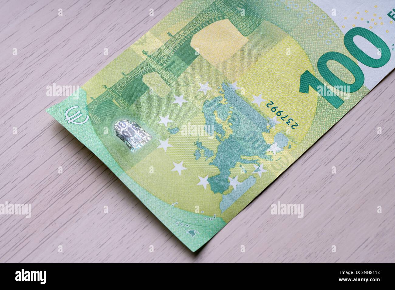 100 euro banknote close up, wooden table background for business ...