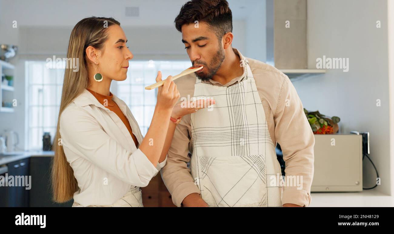 Couple, cooking and together in kitchen and learning for relationship ...
