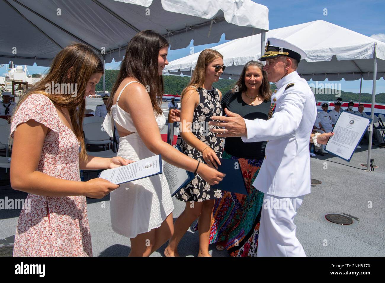PACIFIC OCEAN (July 21, 2022) – Capt. Timothy Quast presents his family ...
