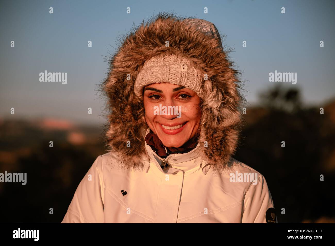 Beautiful female hiker dressed for the cold while hiking at Zion ...