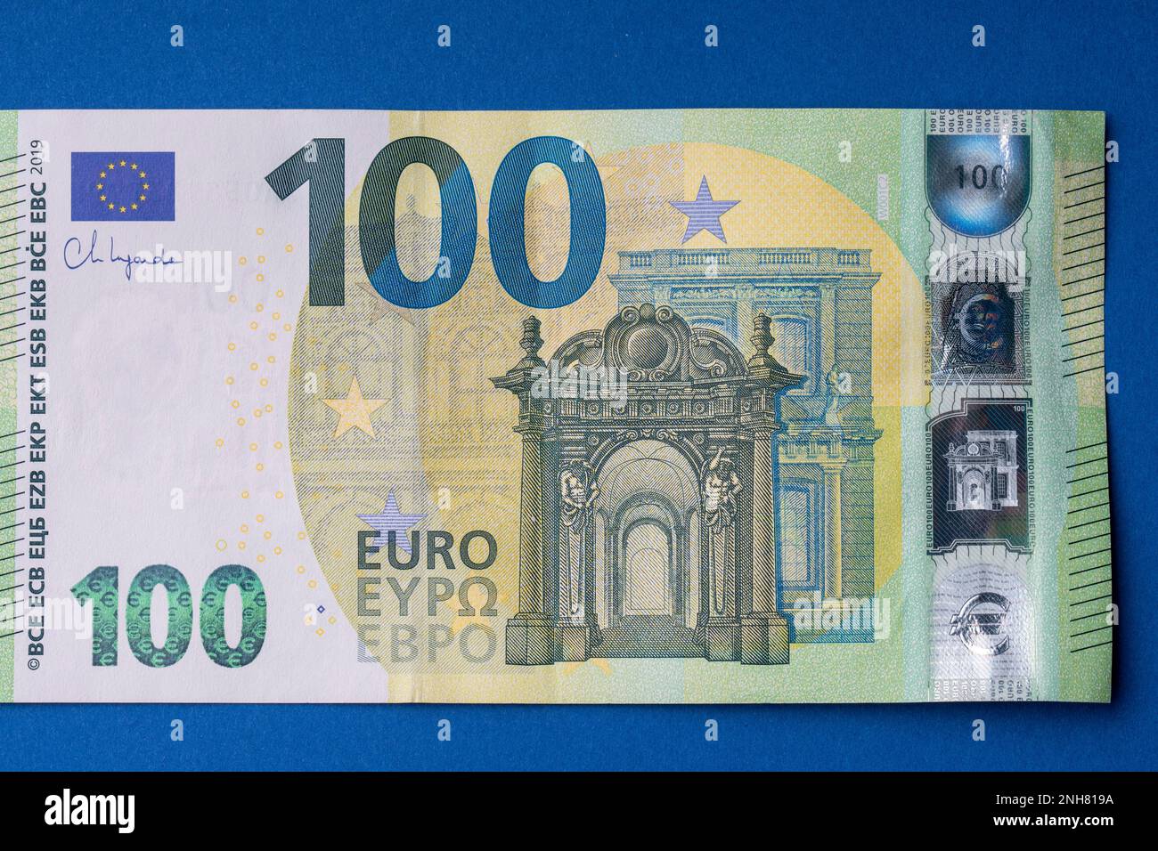 100 euro banknote close up, blue background for business finance topics ...