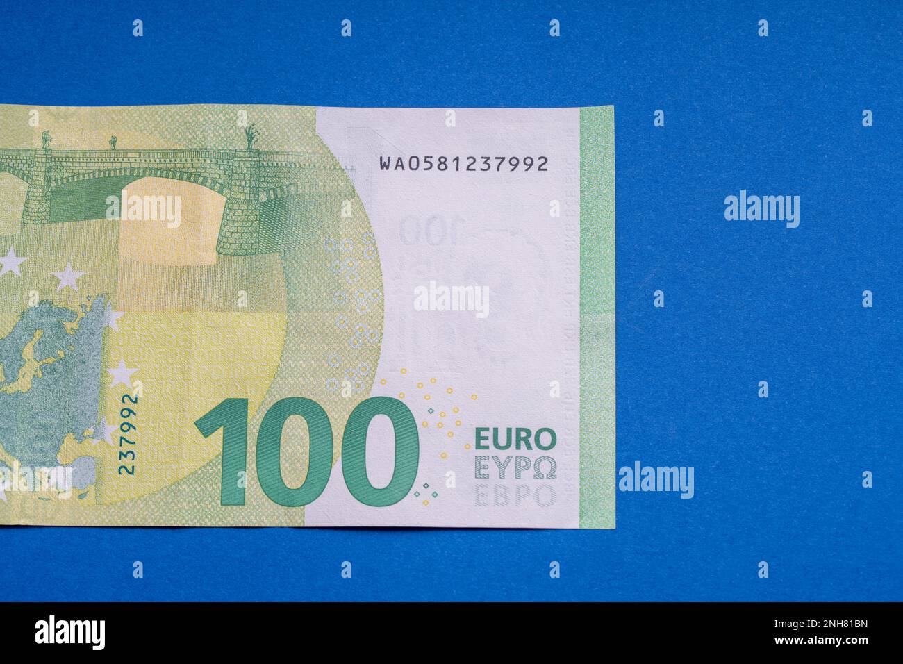 100 euro banknote close up, blue background for business finance topics ...