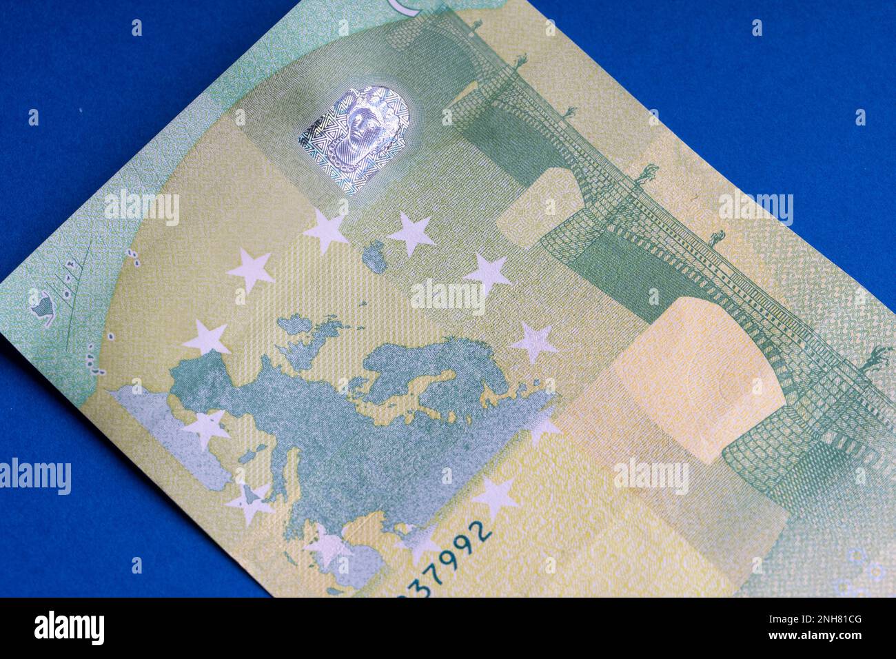 100 euro banknote close up, blue background for business finance topics ...