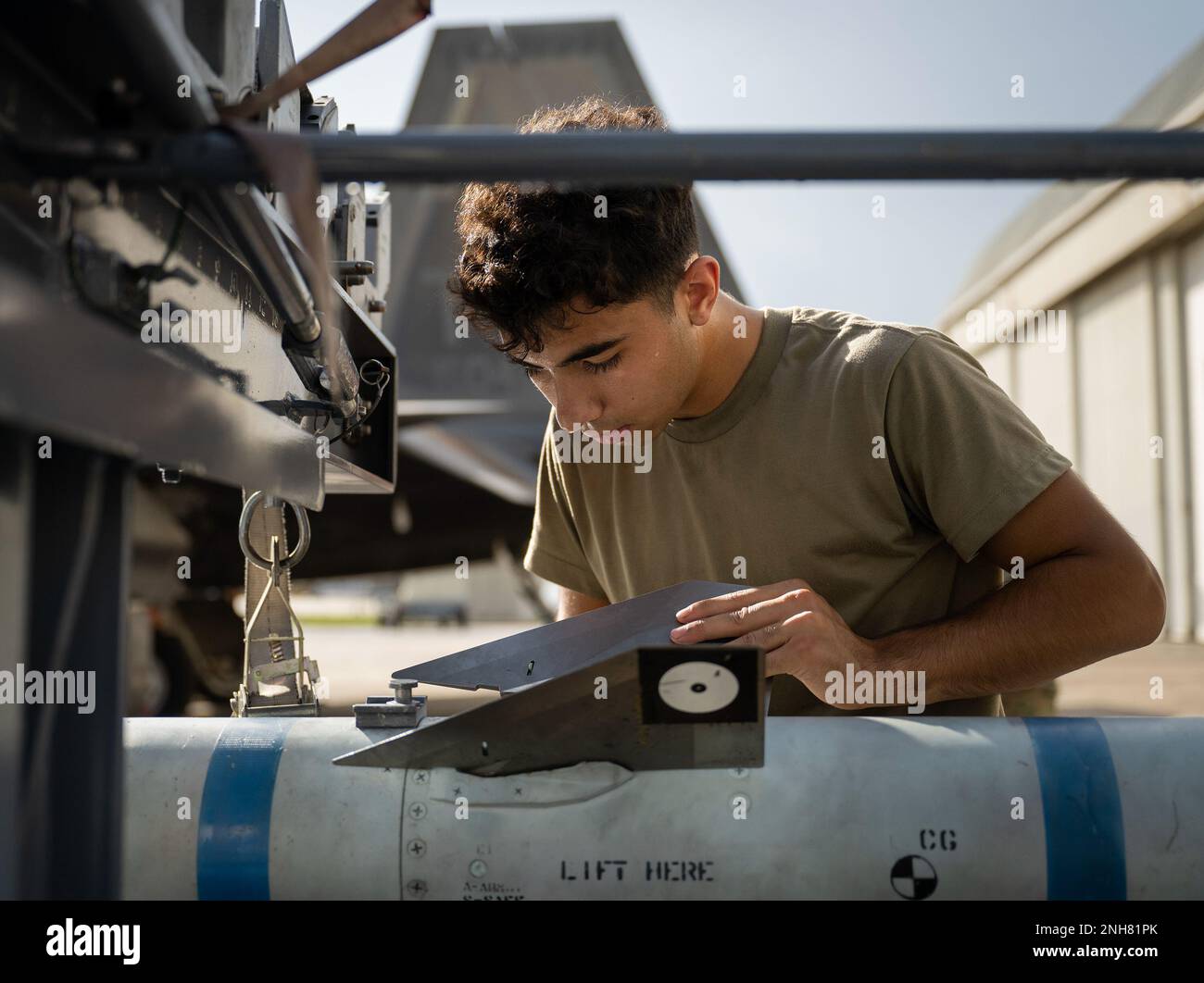 Airman Carmello Alaniz, 43rd Fighter Generation Squadron, secures fins ...
