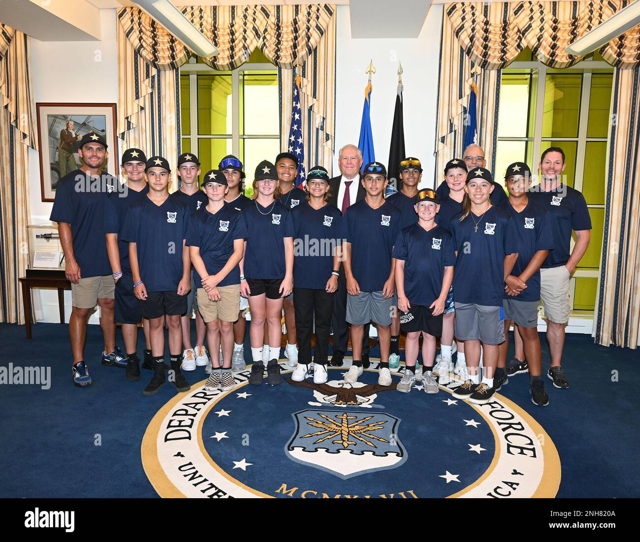 Secretary of the Air Force Frank Kendall (center) poses for a group ...