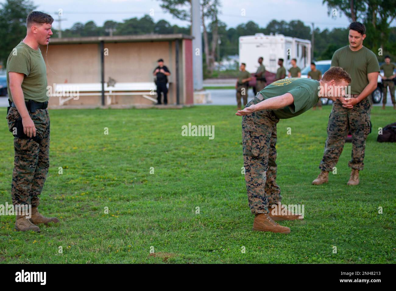 U.S. Marine Corps Cpl. Austin Chelf (second left), a fixed-wing ...