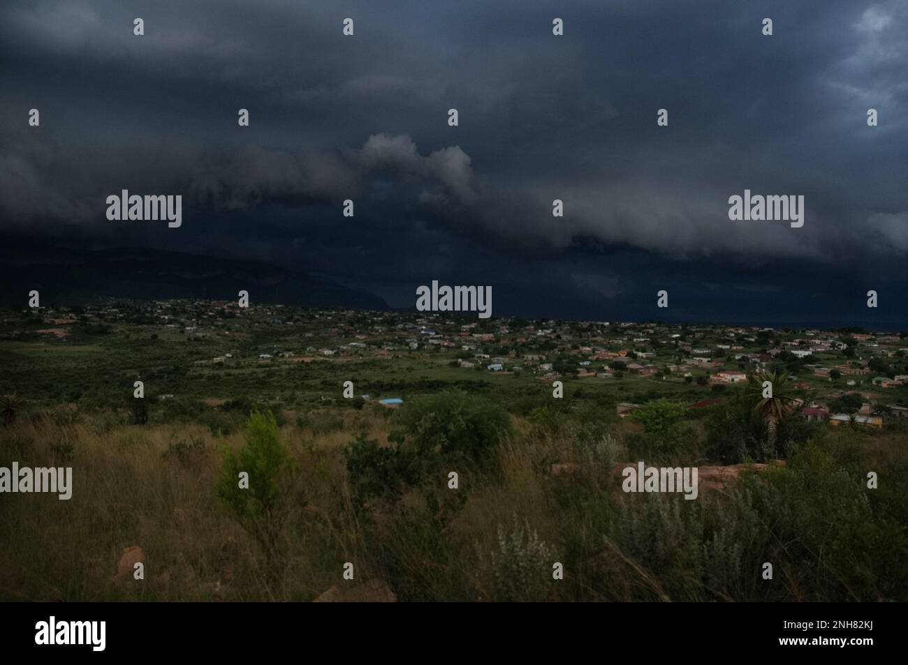 Storm clouds gather over an African village as extreme weather afflicts ...