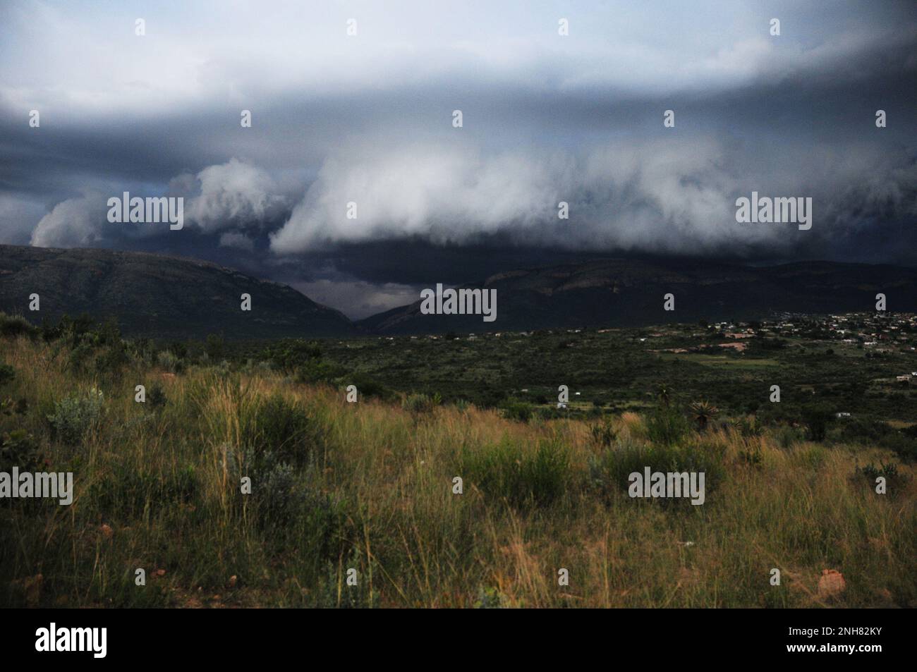 Storm clouds gather over an African village as extreme weather afflicts ...