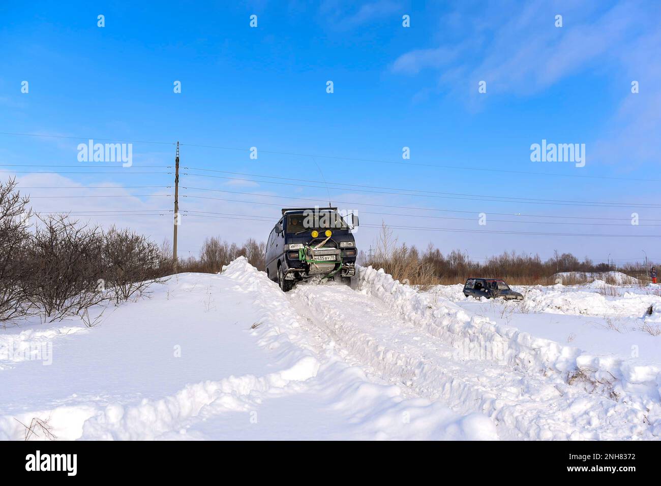 Offroad SUV "Mitsubishi Delica" 4x4 with untwisted winch cable on the ...