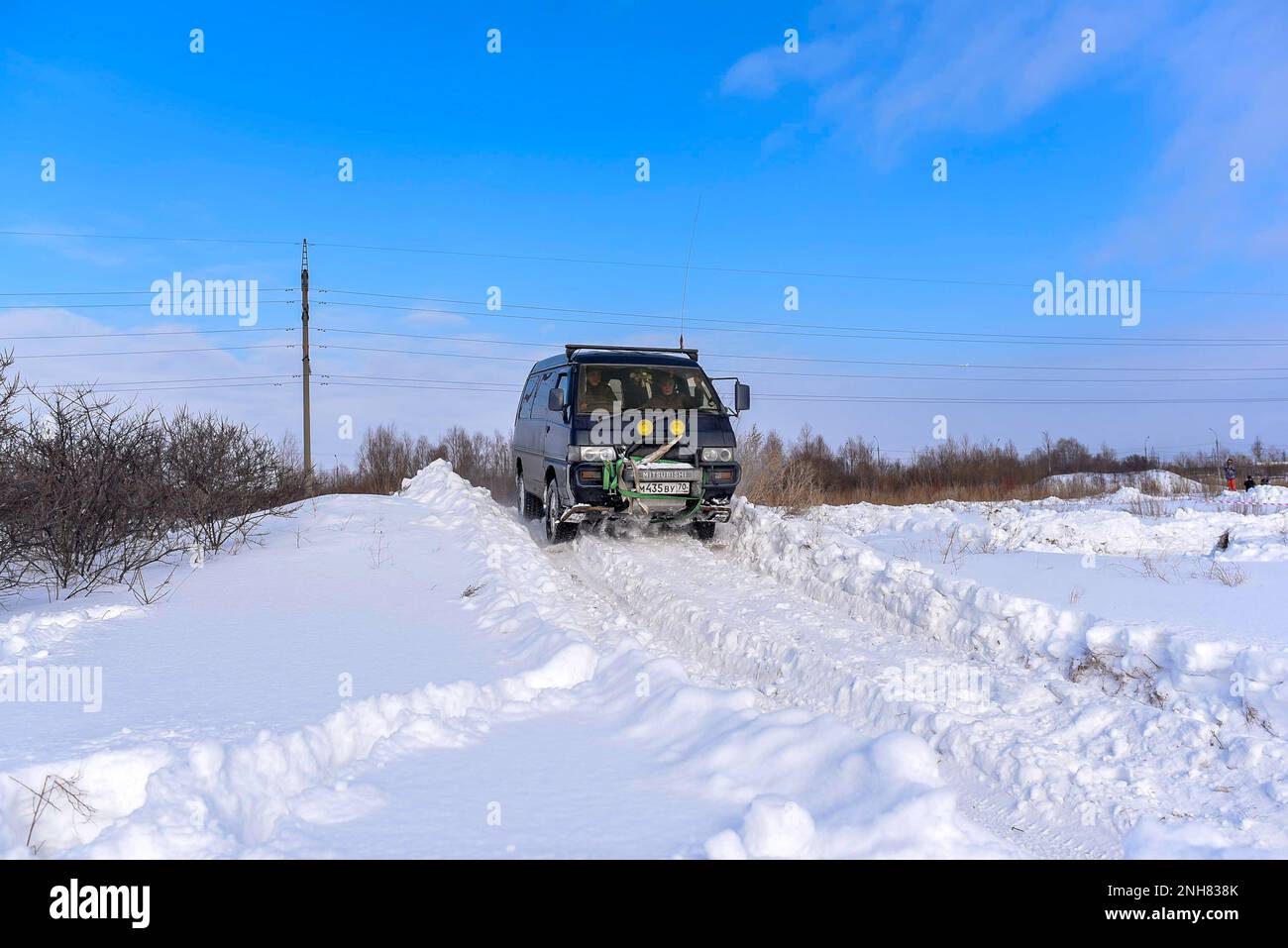 Offroad SUV "Mitsubishi Delica" 4x4 with untwisted winch cable on the ...