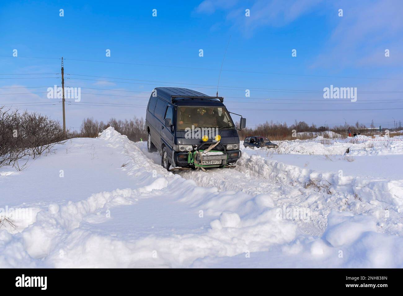 Offroad SUV "Mitsubishi Delica" 4x4 with untwisted winch cable on the ...
