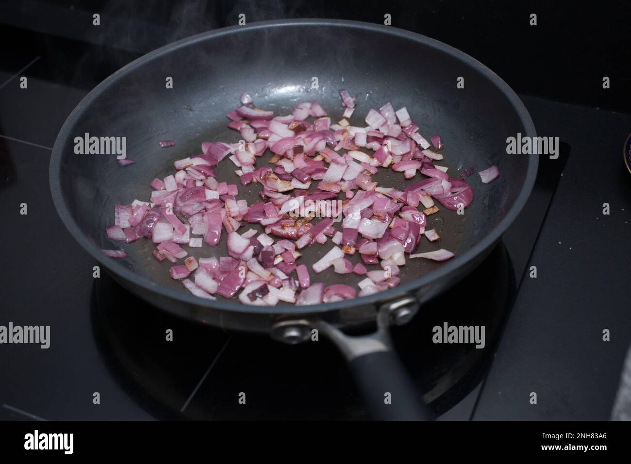 Onions fried in pan on hi-res stock photography and images - Alamy