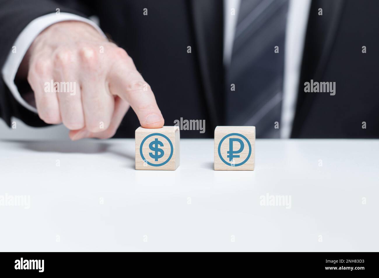 Wooden blocks with currency icons: us dollar and ruble.Choosing the ...