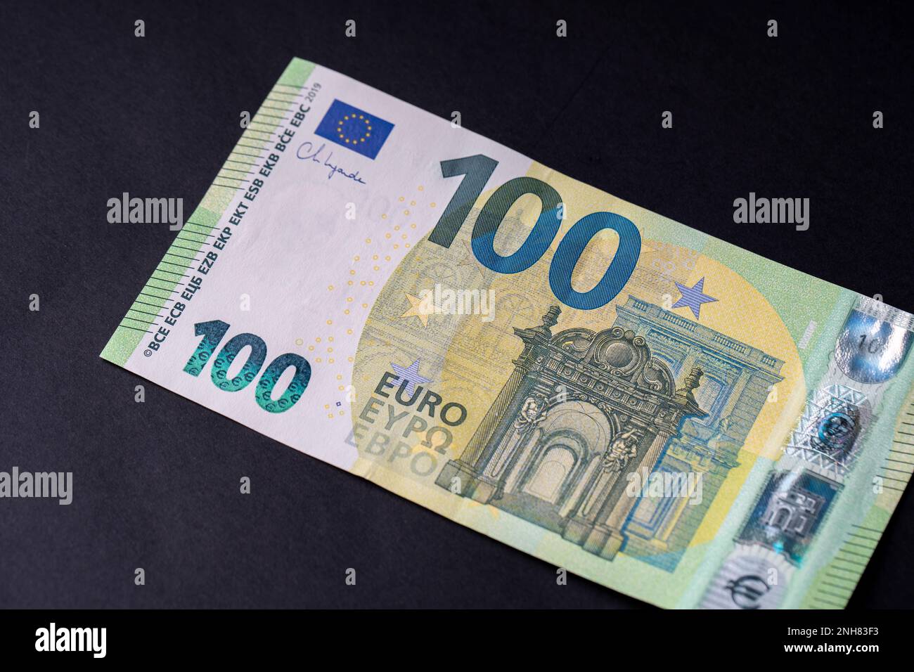 100 euro banknote close up on black background for business finance ...