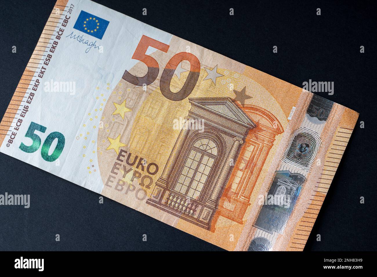 50 euro banknote close up on black background for business finance ...