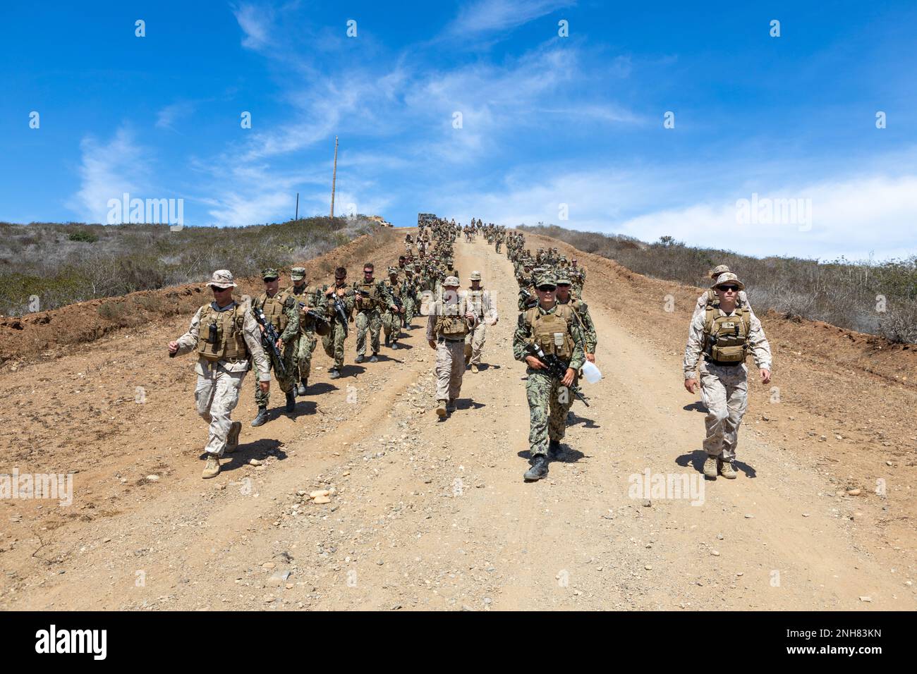 U.S. Naval Academy midshipmen hike up the Reaper, an infamous hill ...