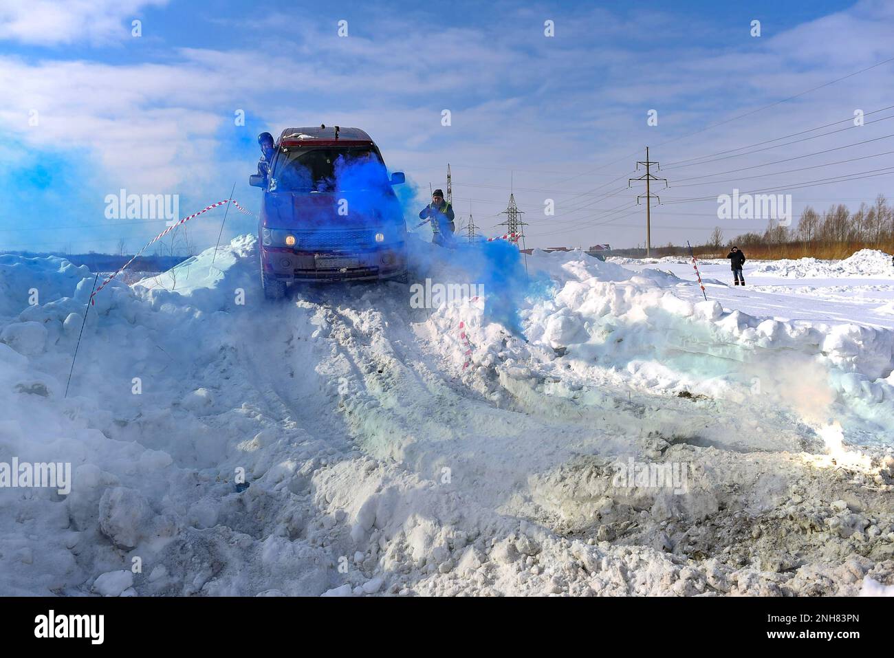 An off-road SUV "Range Rover 4x4" drives down a snowy mountain in ...