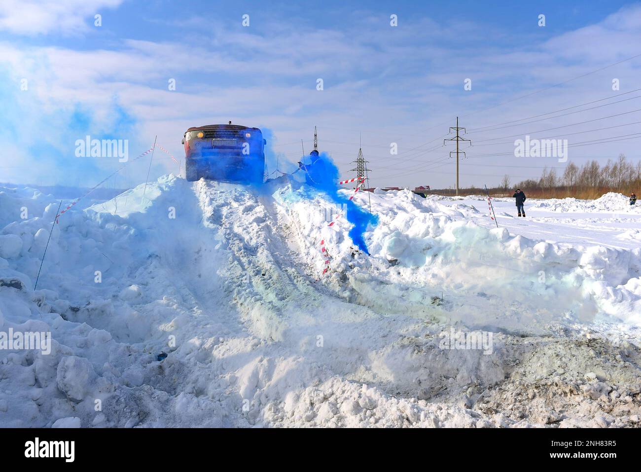 An off-road SUV "Range Rover 4x4" drives down a snowy mountain in ...
