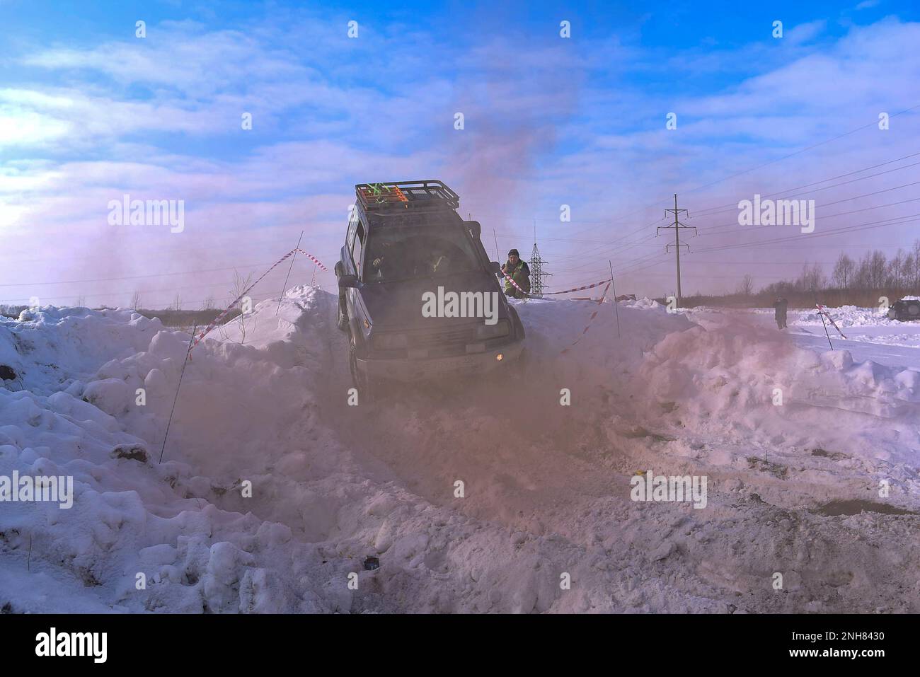 Offroad SUV "Suzuki Escudo" 4x4 quickly goes on a snowy road in the ...