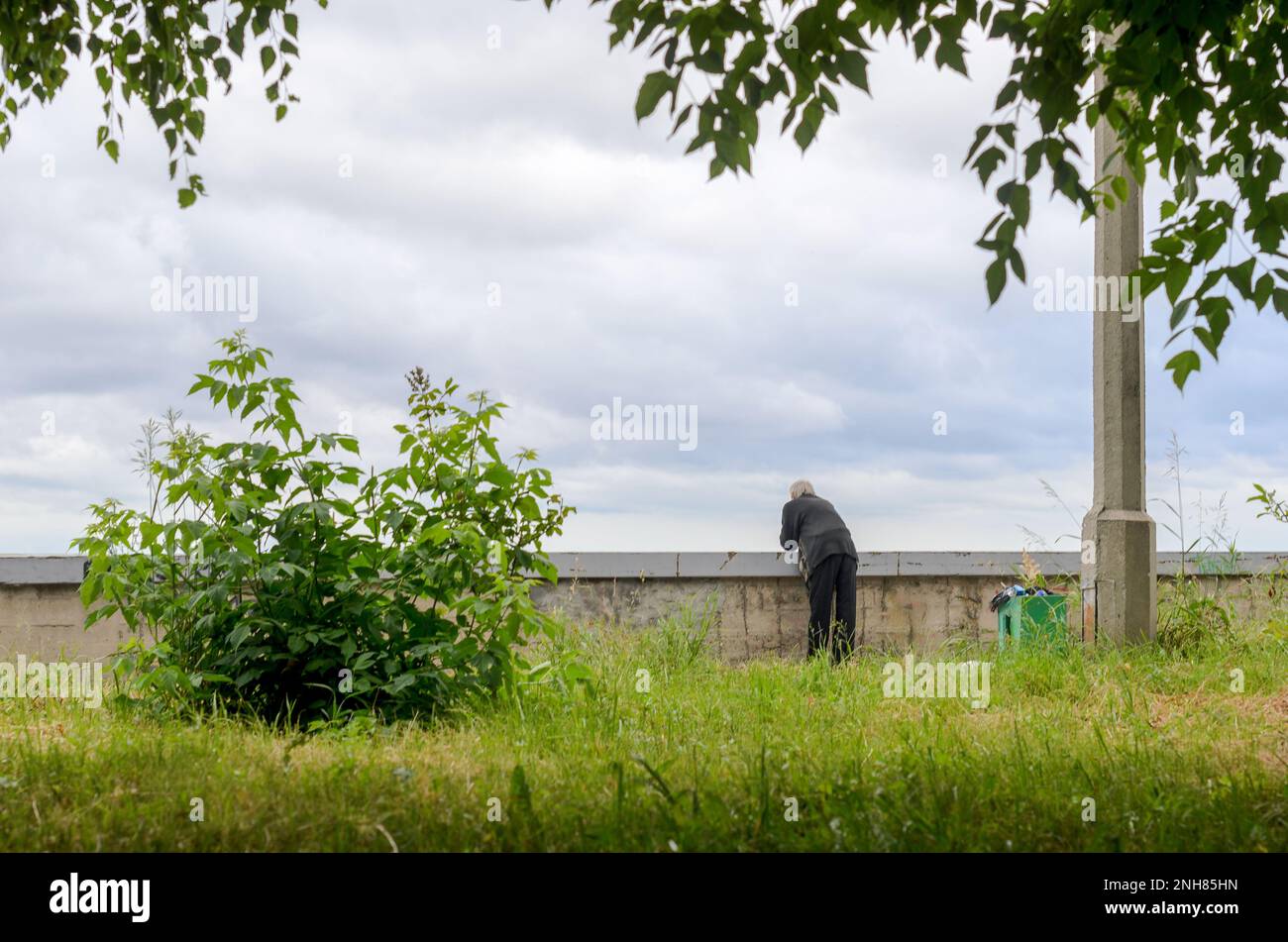Old man stands hi-res stock photography and images - Alamy