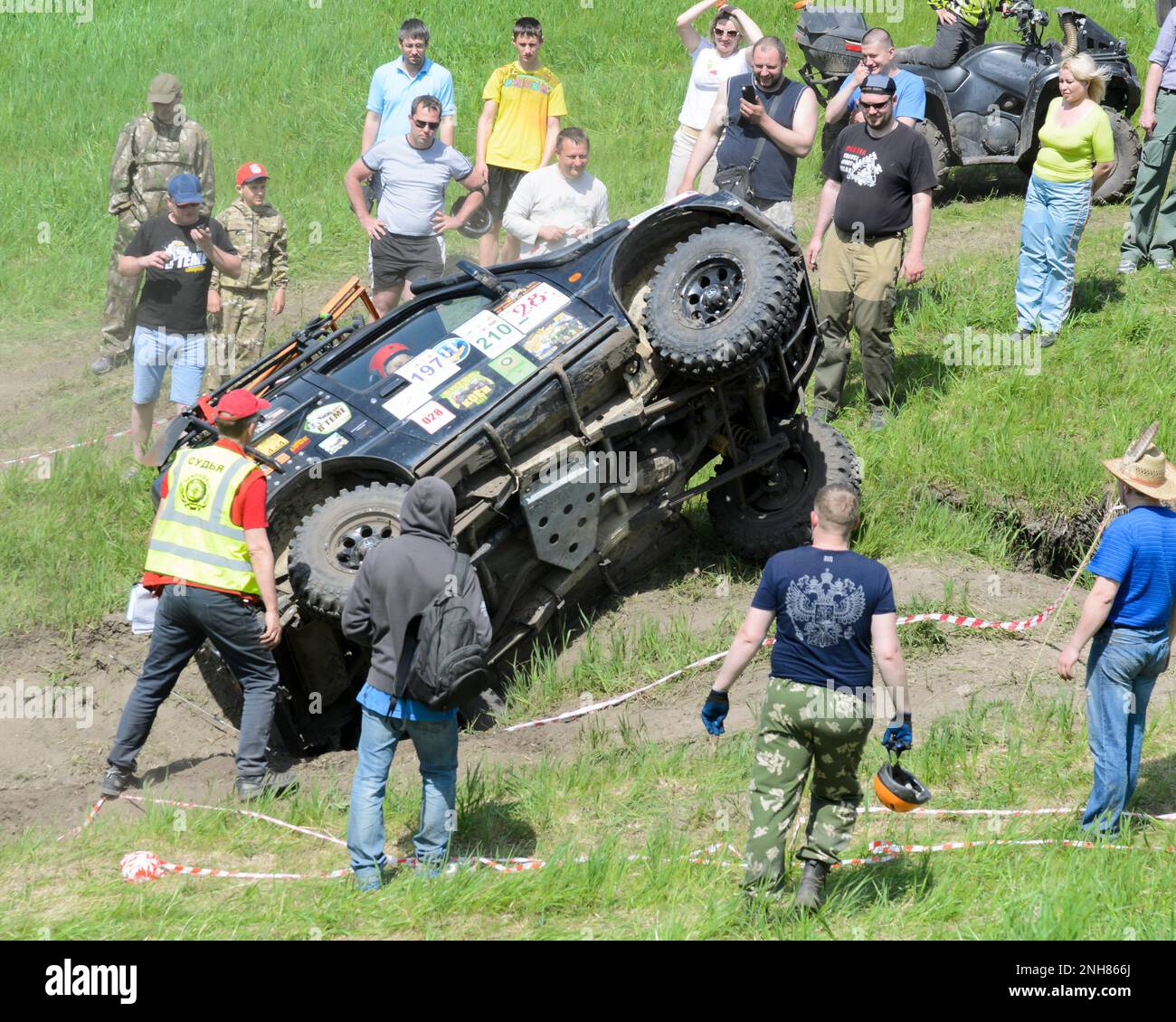 Crowd of spectators looking at the car "Suzuki Jimny" which is highly ...