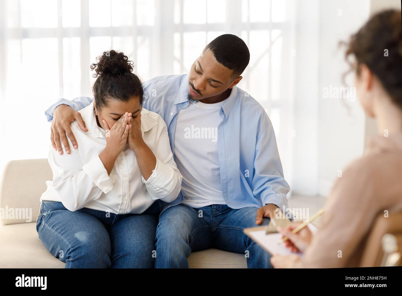 Loving black man comforting crying girlfriend, attend family therapy ...