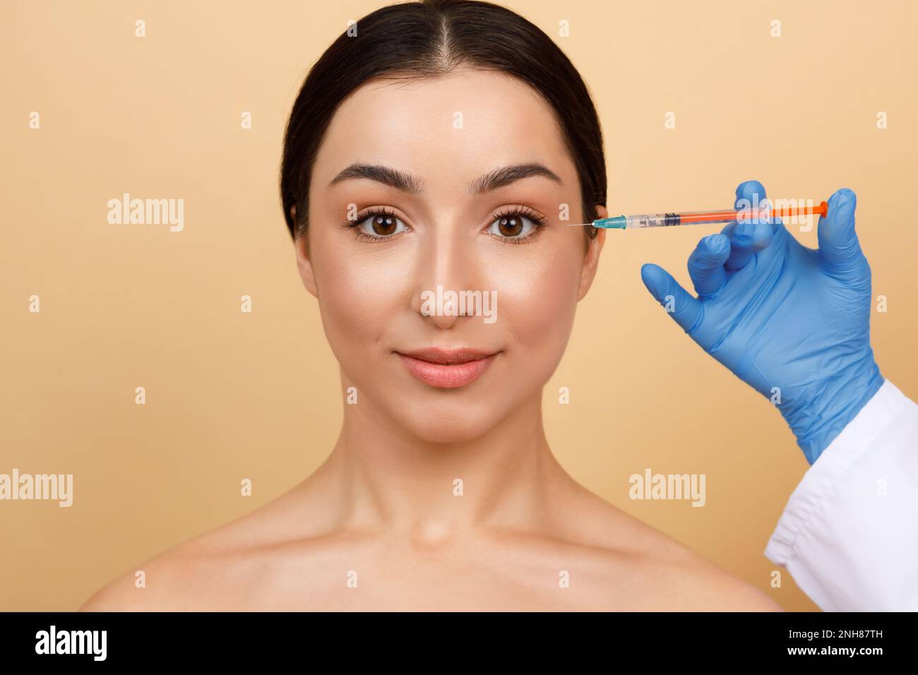 Woman getting botox injection face hi-res stock photography and images ...