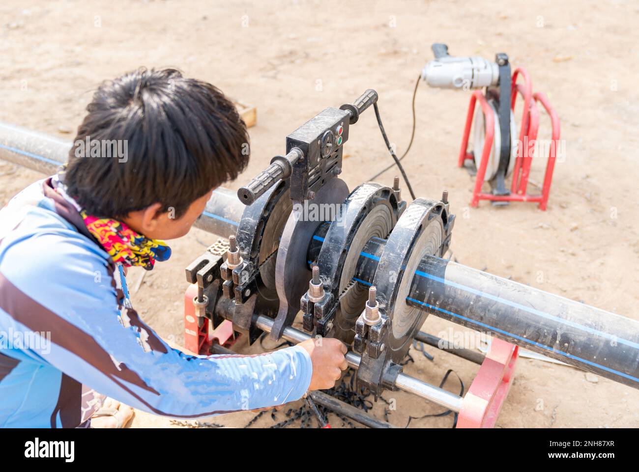 Worker pipeline weld joints heat the pipe in construction site Stock ...
