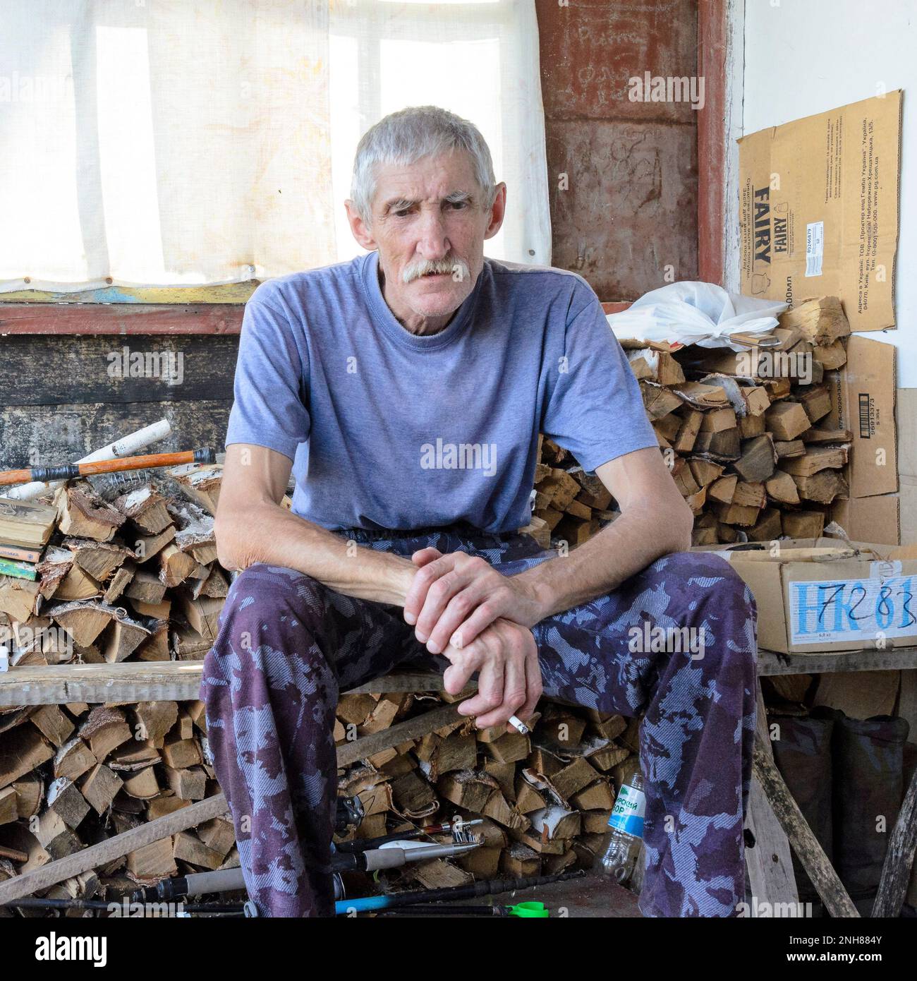 The gray-haired man with a white mustache t-shirt and protective pants ...