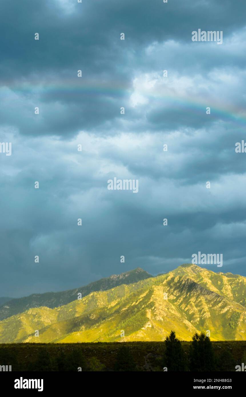 A great rainbow after the rain from the mountains to the forest in the ...