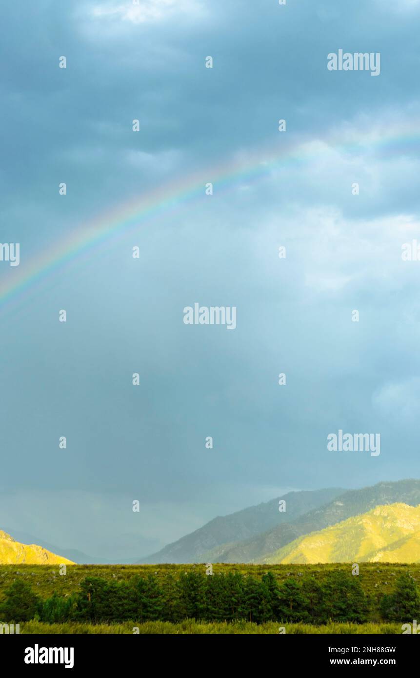 A great rainbow after the rain from the mountains to the forest in the ...