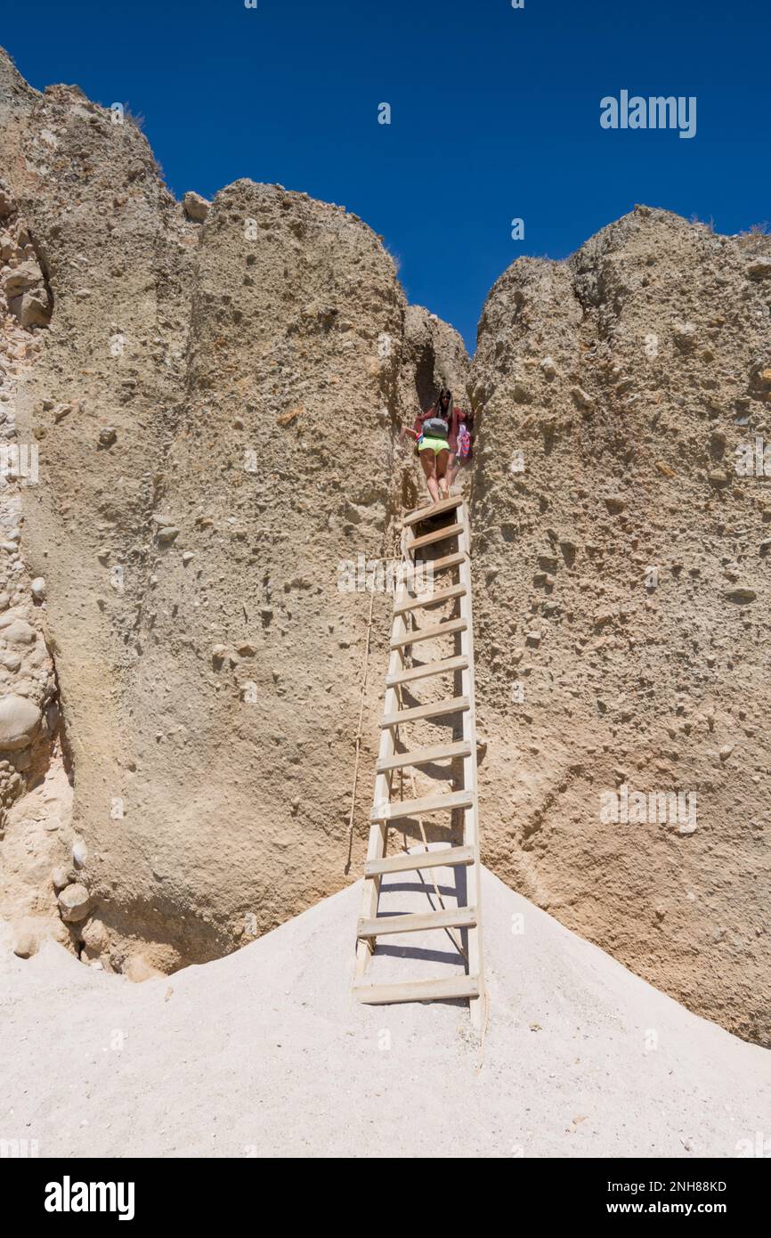 Woman going down a ladder hi-res stock photography and images - Alamy