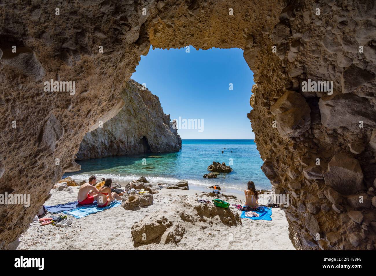 Tsigrado beach seen from inside a cave, Milos Stock Photo - Alamy