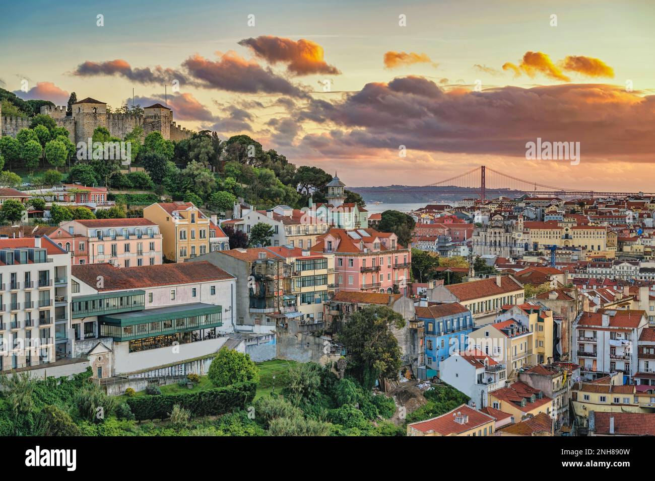 Lisbon Portugal sunset city skyline at Lisbon Baixa district and Saint ...
